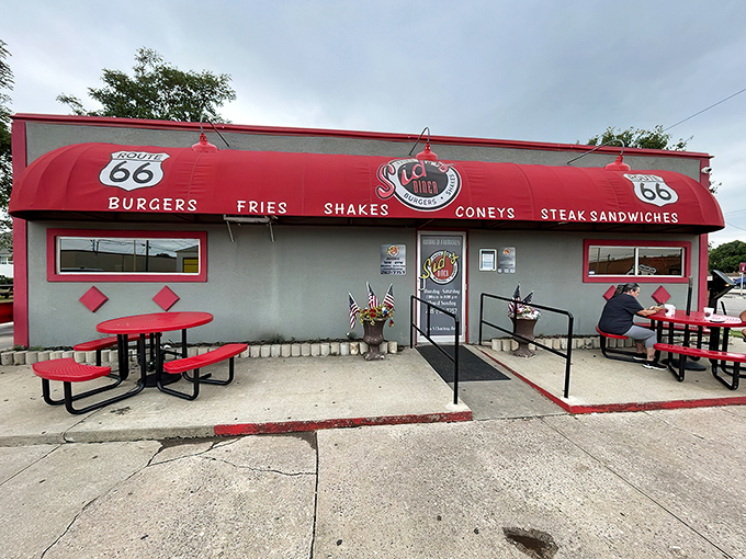 Route 66 nostalgia comes alive at Sid's Diner, where the bright red awning beckons hungry travelers like a culinary lighthouse in El Reno.