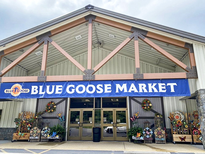 The rustic timber-framed exterior of Blue Goose Market beckons like an oasis for hungry travelers on Maryland's historic National Road.