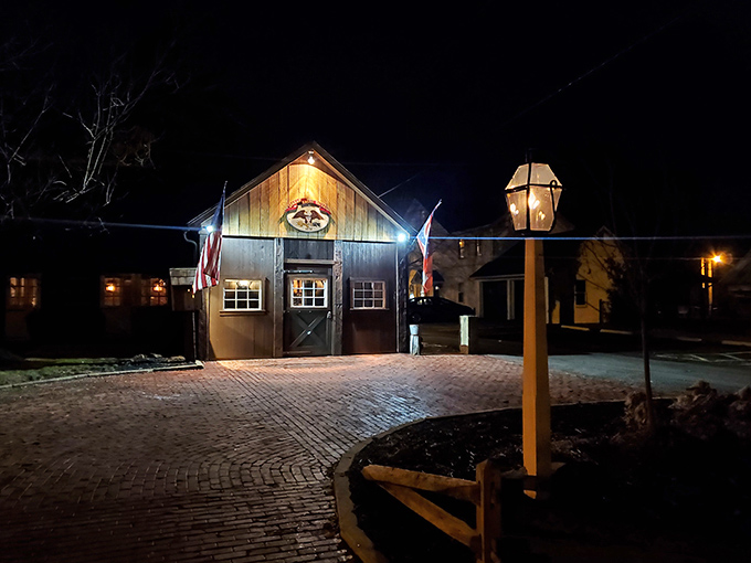 The Spread Eagle Tavern glows like a welcoming beacon in the night, its historic charm beckoning hungry travelers with promises of culinary delights within.