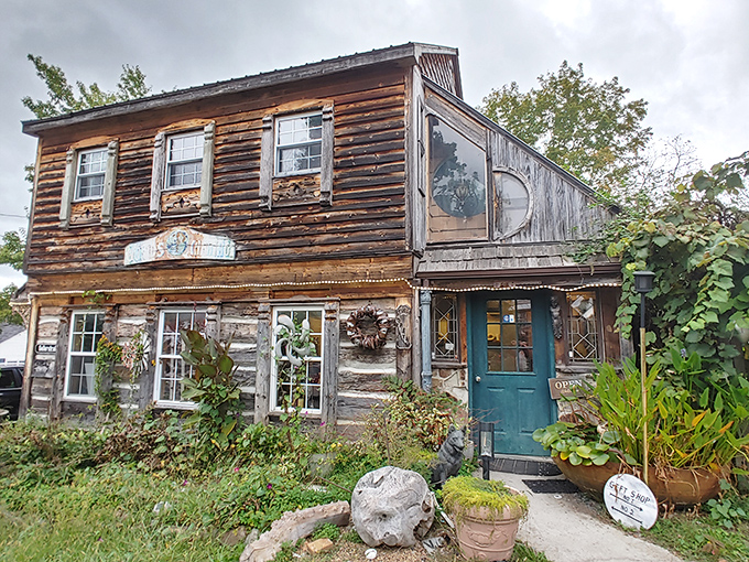 The Log House 1776 stands proudly in Wytheville, its weathered wooden exterior telling stories of centuries past while flowering wisteria adds a touch of romance.