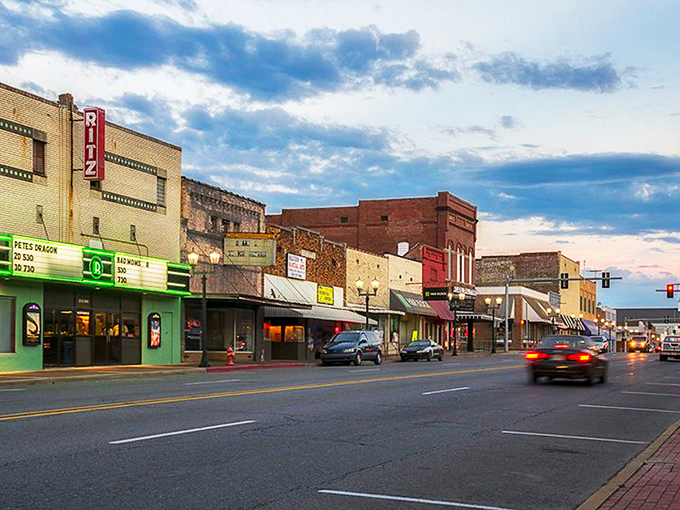 Malvern's Main Street at dusk captures that perfect small-town moment when the streetlights flicker on and the brick buildings glow with warmth and history.