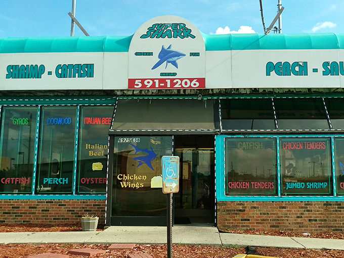 The blue awning of Super Shark beckons like a maritime mirage in landlocked Indianapolis. Who knew seafood paradise was hiding behind that shark logo all along?