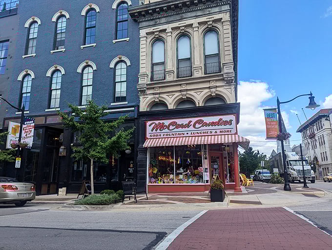 The iconic red and white striped awning of McCord Candies stands like a beacon of sweetness on Lafayette's Main Street, inviting passersby into a world of nostalgic treats.