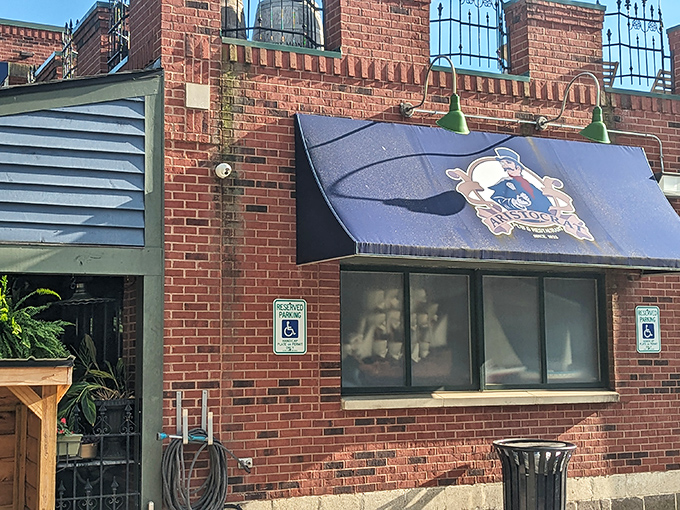 The brick facade of Aristocrat Pub welcomes you like an old friend, complete with wooden gable entrance and lush hanging ferns creating instant curb appeal.