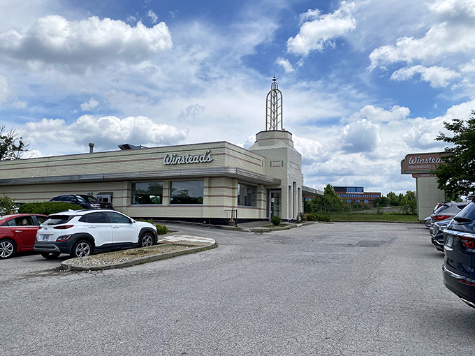 The iconic Art Deco exterior of Winstead's stands as a time capsule of mid-century design, complete with that unmistakable spire reaching skyward.