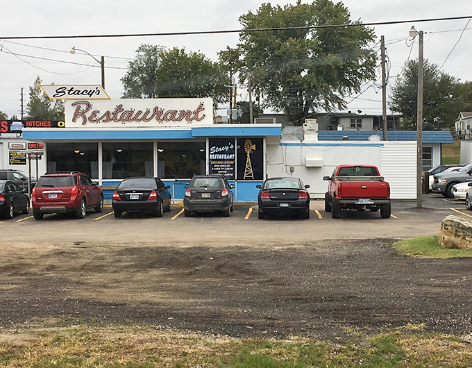 The classic neon sign beckons like an old friend. Stacy's Restaurant stands proudly against the Kansas sky, promising comfort and nostalgia with every meal.