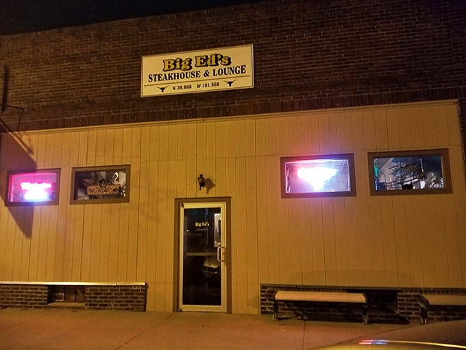 The yellow sign beckons like a prairie lighthouse, guiding hungry travelers to this brick-faced beacon of beef in Bird City.