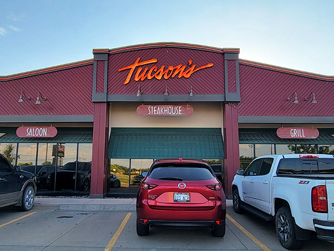 The burgundy facade of Tucson's glows with promise, like a beacon calling to hungry travelers. Those illuminated signs aren't just decoration—they're a dinner invitation you can't refuse.