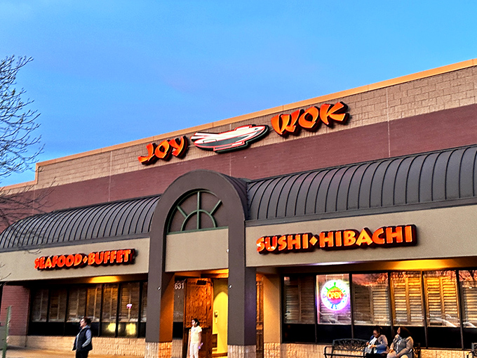 The bright red signage of JOY WOK beckons like a culinary lighthouse, promising a harbor of flavors that'll make your taste buds throw a parade.