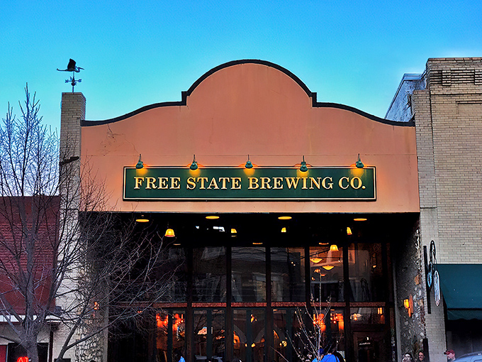 The iconic fa&ccedil;ade of Free State Brewing Company stands proudly on Massachusetts Street, like a beacon calling all hungry travelers home.
