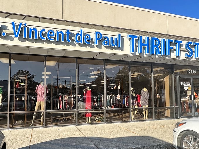 The blue signage of St. Vincent de Paul beckons like a thrift store lighthouse, promising treasures within those glass doors.