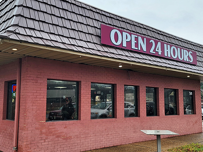 The brick-red exterior with its shingled roof and "OPEN 24 HOURS" sign isn't just a building&mdash;it's a beacon of hope for the hungry at any hour.