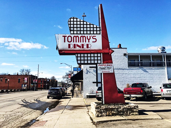 That iconic red and white sign isn't just advertising &ndash; it's a time machine promising comfort food and nostalgia at Tommy's Diner in Columbus.