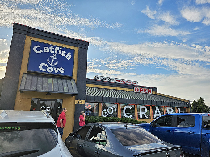 The blue and tan exterior of Catfish Cove stands like a seafood oasis in landlocked Oklahoma, boldly proclaiming "GOT CRAB" to passing motorists.