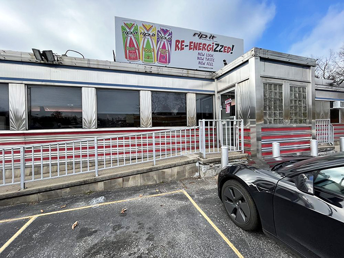 The gleaming stainless steel exterior of Overlea Diner shines like a time machine to the 1950s, complete with those iconic red stripes that practically scream "Come eat with us!"