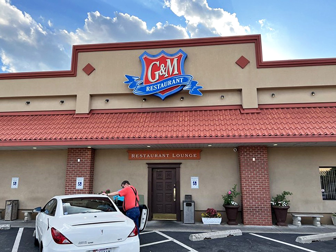 The unassuming exterior of G&M Restaurant hides culinary treasures within, like a delicious secret waiting behind that distinctive blue shield logo.