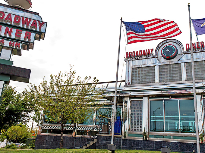 The neon glow of Broadway Diner's sign is like a lighthouse for hungry travelers, promising comfort and satisfaction just off Eastern Avenue.