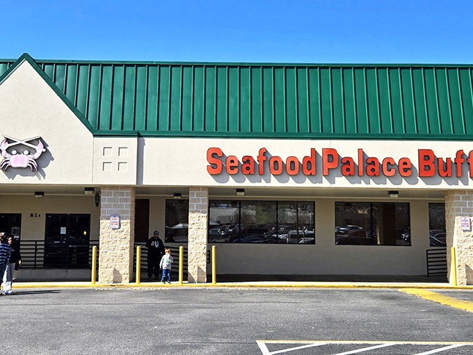 The unassuming exterior of Seafood Palace Buffet stands like a seafood speakeasy, its little crab logo promising treasures that belie its strip mall location.
