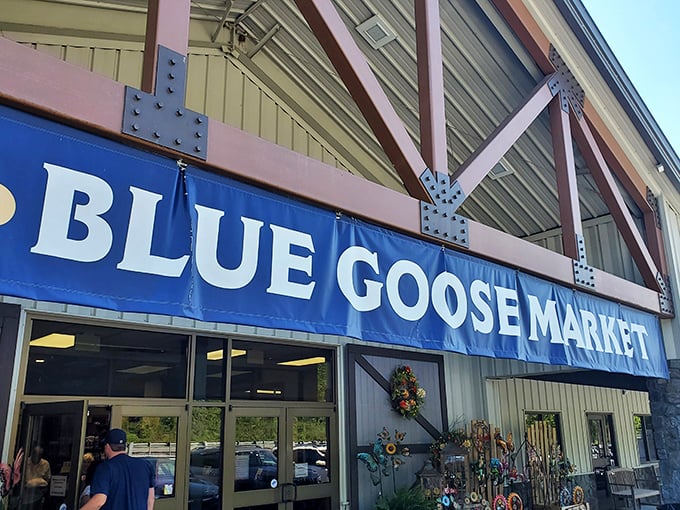 The rustic timber-framed exterior of Blue Goose Market beckons like an oasis for hungry travelers on Maryland's historic National Road.