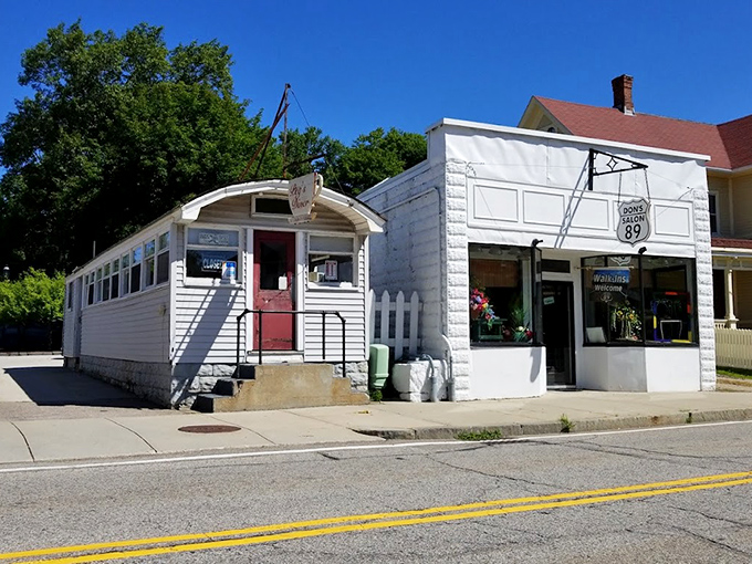 The unassuming white exterior with that pop of red door is like finding a treasure map in your attic&mdash;modest packaging, extraordinary reward inside.