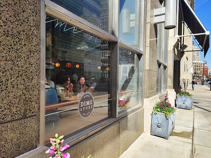 The unassuming storefront of Dime Store beckons from downtown Detroit, where flower boxes and large windows hint at the culinary treasures waiting inside.