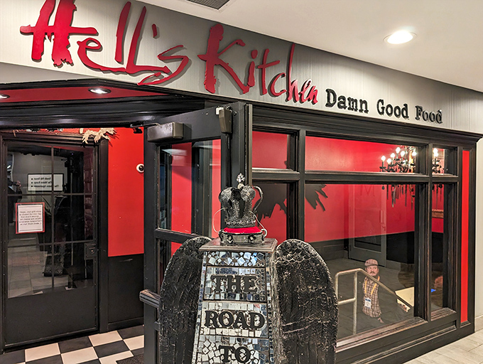 The entrance to culinary rebellion: Hell's Kitchen's bold red signage promises "Damn Good Food" &ndash; a Minneapolis institution that delivers on its devilish declaration.