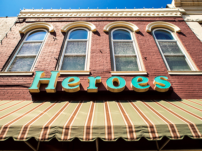 Heroes Restaurant & Pub stands like a culinary sentinel on Pine Street, its historic brick facade and turquoise sign promising comfort and satisfaction within. 