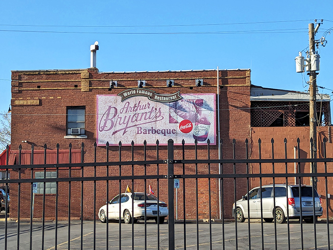 The iconic brick facade and bold red sign of Arthur Bryant's stands as a beacon of barbecue excellence against the Kansas City sky. 