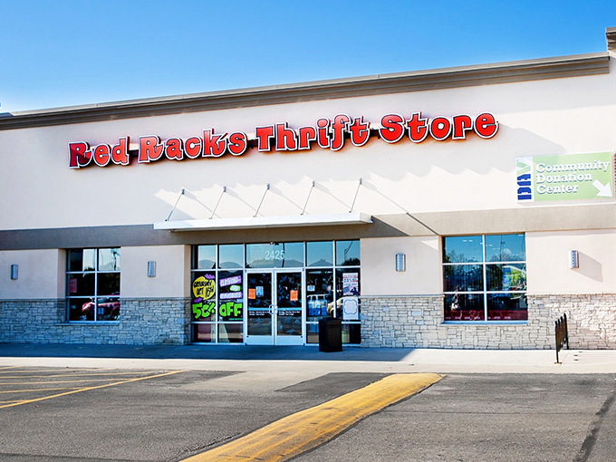 The bright red signage promises treasure within these walls, where bargain hunters and do-gooders unite in the pursuit of secondhand glory.