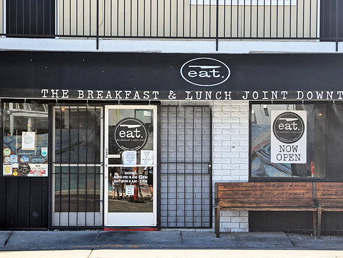 A modest storefront with a wooden bench that whispers, "The best culinary experiences often hide behind the simplest facades." Downtown Las Vegas's best-kept breakfast secret awaits.