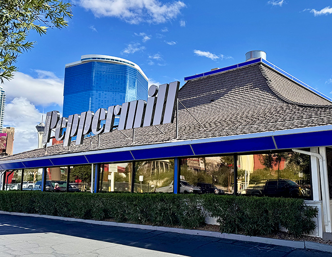 The iconic pagoda-style roof of Peppermill stands like a neon oasis amid the desert of Vegas excess, promising comfort food salvation 24/7.