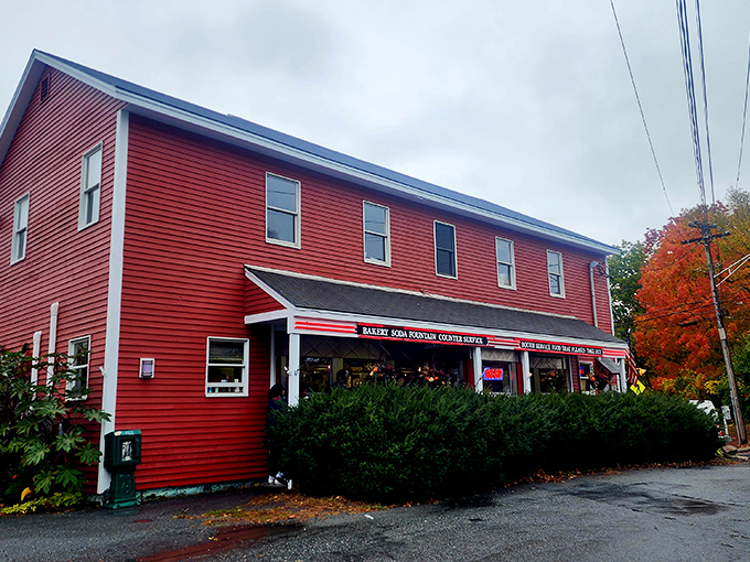 The cherry-red exterior of Four Aces Diner stands out like a winning hand in West Lebanon, beckoning hungry travelers with its classic Americana charm.
