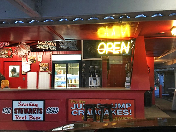 The red and white striped awnings of Big Daddy's stand like a culinary lighthouse, complete with that unmistakable giant crab on the roof announcing: seafood salvation ahead!
