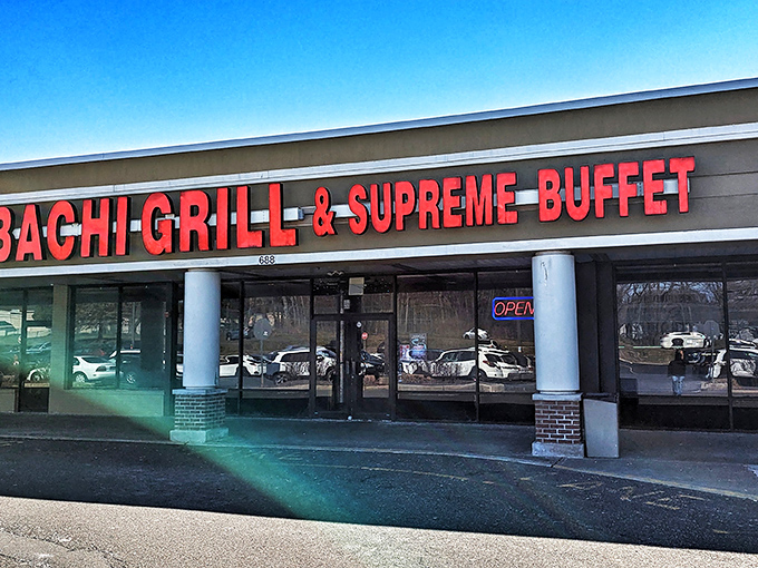 The bright red signage acts like a beacon for hungry souls. Simple storefront, extraordinary promises of culinary abundance within.