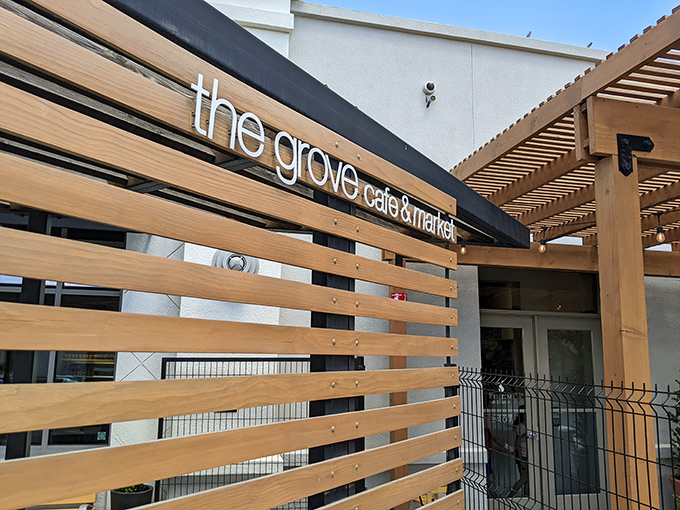 The wooden slat exterior of The Grove isn't just stylish&mdash;it's a preview of the warmth waiting inside, like a delicious secret the building can barely contain.