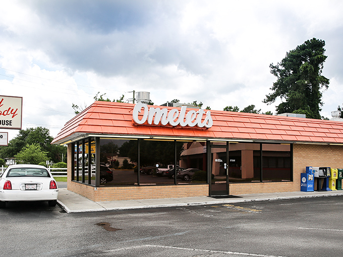 The iconic orange roof of Goody Goody Omelet House stands out like a breakfast lighthouse guiding hungry souls to their morning salvation. 