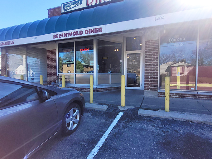 The blue awning of George's Beechwold Diner stands like a beacon of breakfast hope on Columbus's north side, promising comfort food salvation to all who enter.