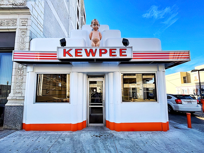 The iconic Kewpee exterior stands like a time capsule in downtown Lima, complete with its signature doll mascot keeping watch over hungry visitors.