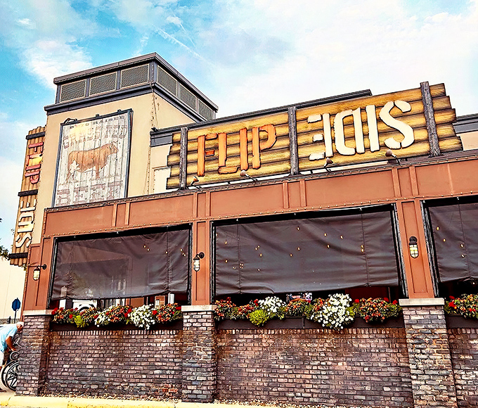 The wooden "FLIP SIDE" sign beckons like a lighthouse for the burger-obsessed. Those flower boxes aren't just pretty&mdash;they're a promise of good things to come.