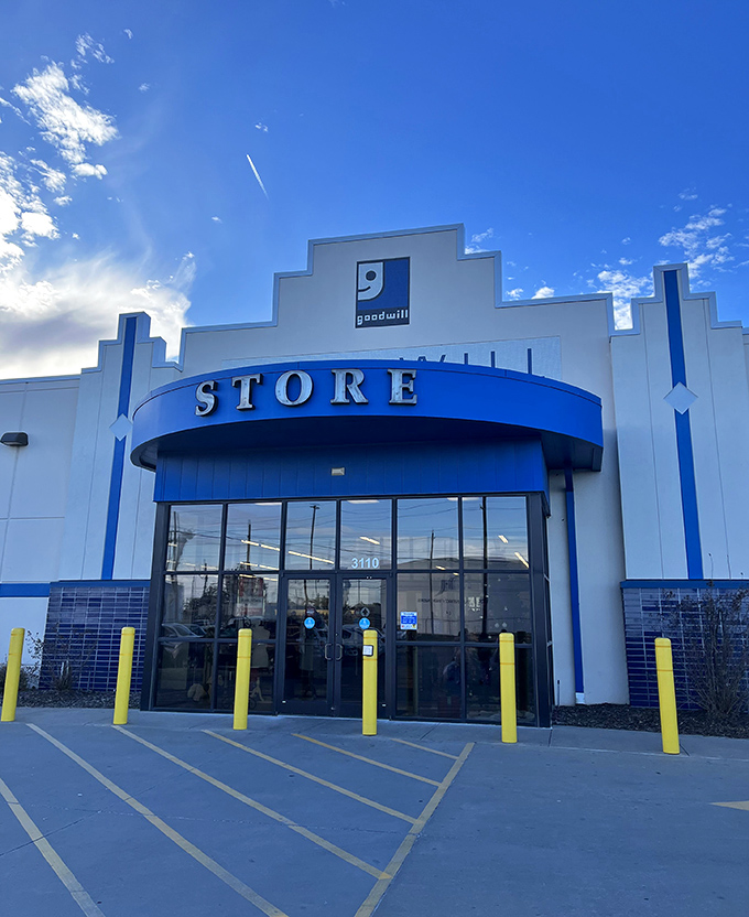 The iconic blue and white facade of Goodwill on Southwest Boulevard stands like a beacon for bargain hunters under Oklahoma's expansive sky.