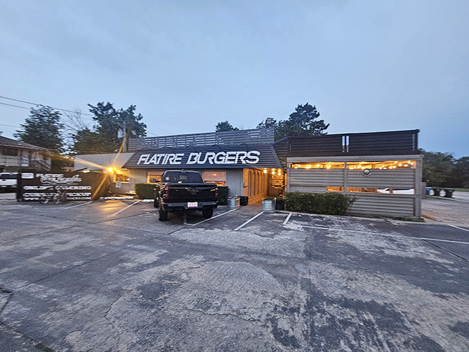 The unassuming exterior of Flatire Burgers belies the culinary magic happening inside. Like finding a diamond in a parking lot.