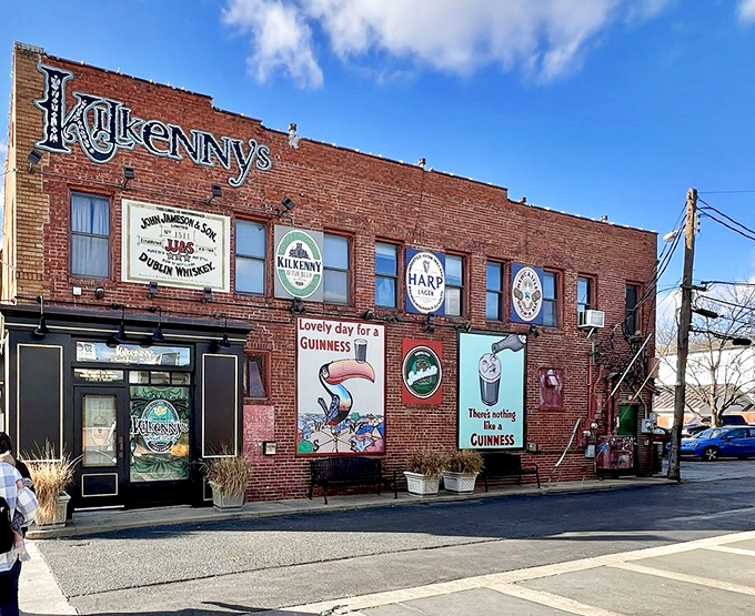 The brick facade of Kilkenny's stands proudly on Cherry Street, its vintage Guinness murals and emerald signage promising authentic Irish comfort in the heart of Tulsa.