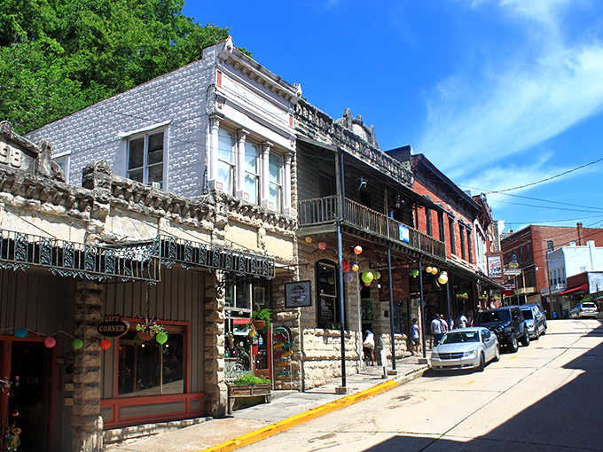 Downtown Eureka Springs winds like a Victorian dream, where red brick buildings and stone facades create a living postcard of Ozark Mountain charm.