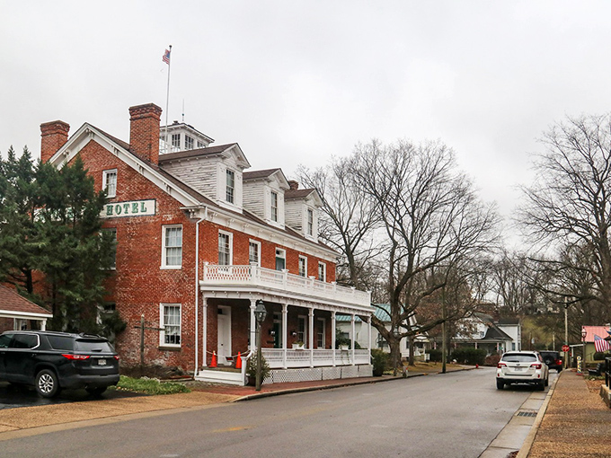 The historic Hotel Ste. Genevieve stands as a red brick sentinel to the past, welcoming visitors with its wraparound porch and promise of stories within.