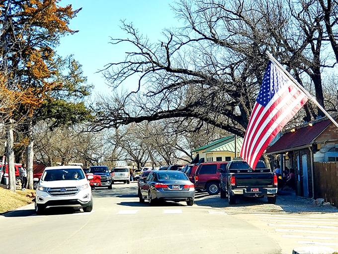 Main Street charm on full display! Medicine Park's cobblestone buildings and American flags create that perfect small-town vibe that makes you want to linger all afternoon.