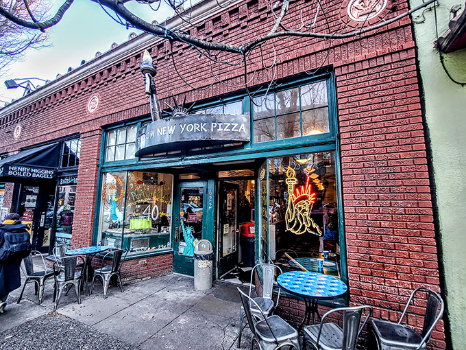 The unassuming brick exterior of Escape from New York Pizza on NW 23rd Avenue promises zero pretension and maximum flavor.