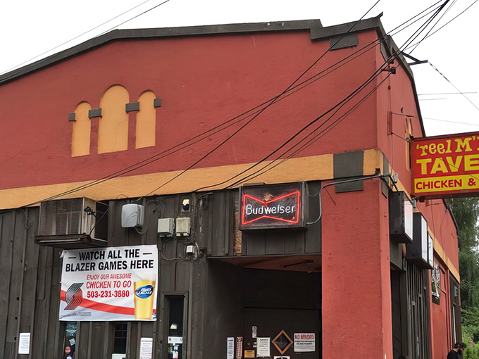 The unassuming red exterior of Reel M Inn stands defiant against Portland's hipster evolution, like a time capsule of dive bar perfection waiting to be discovered.