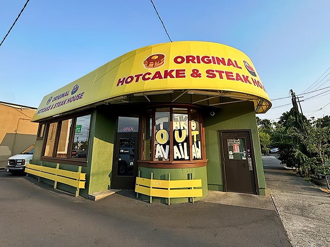 The turquoise and yellow exterior stands like a beacon of breakfast hope on Powell Boulevard, promising 24-hour satisfaction for hungry Portlanders.