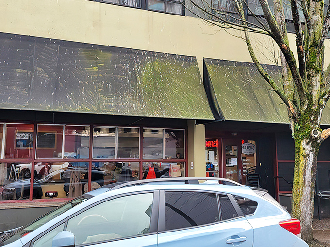 Fuller's iconic storefront beckons hungry Portlanders with its vintage neon "BREAKFAST" sign—a beacon of hope for morning hunger emergencies.
