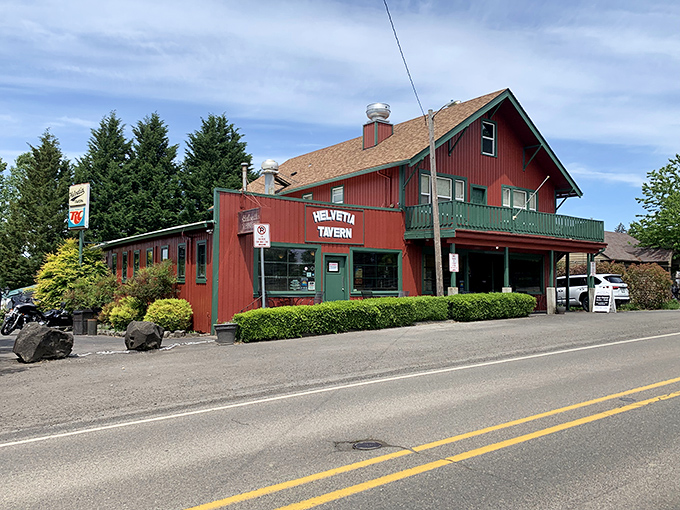 The red farmhouse-style building stands proudly against Oregon's blue sky, like a burger beacon calling hungry travelers home.